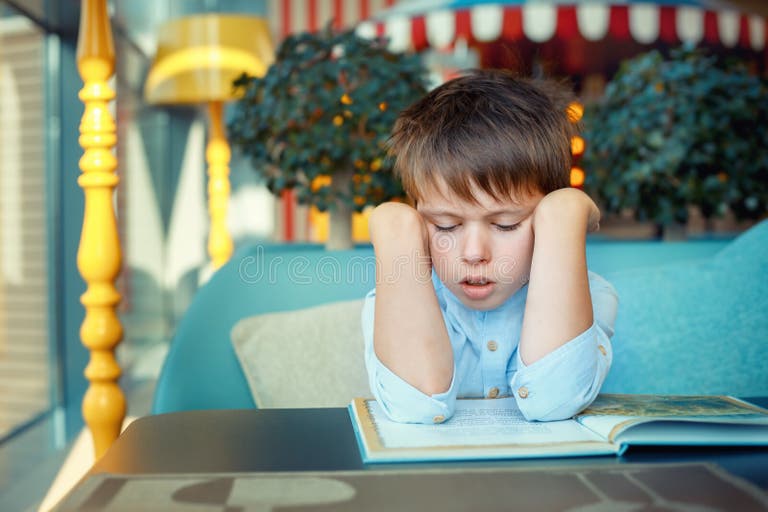 Boring and Tired Little Boy Reading Book Stock Image - Image of bored ...