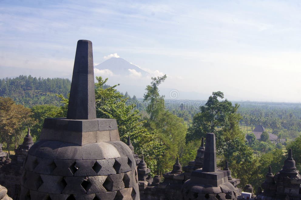 Borobudur Stupas with Active Merapi Volcano in the Background ...
