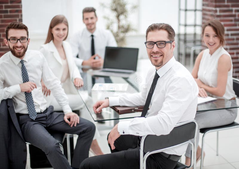 Boss and Business Team Sitting at Their Desk Stock Photo - Image of ...