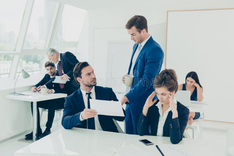 Boss Checking Financial Plan of Team of Young Managers Stock Image ...