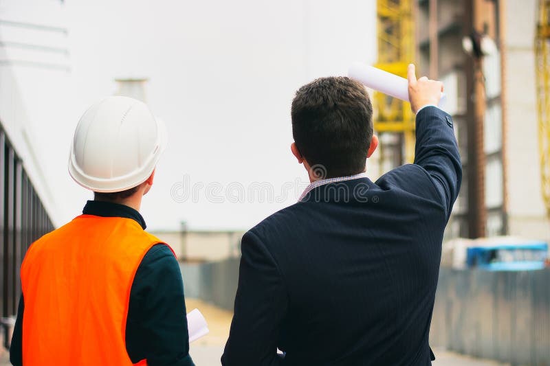 Boss Shows a Construction Project To Engineer. Business Modern ...