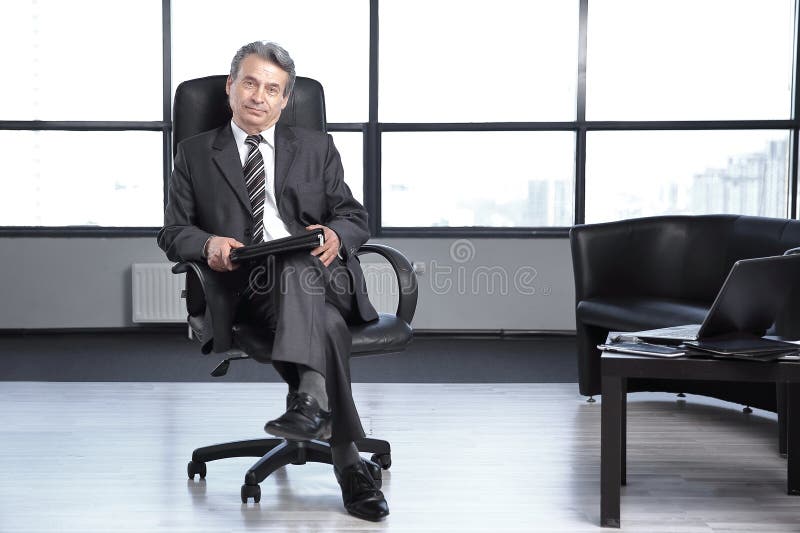Boss with a Clipboard , Sitting in an Office. Photo with Copy Space ...