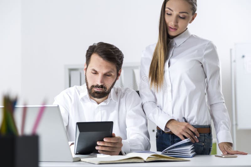 Boss is Looking at Secretary S Tablet Stock Photo - Image of desk ...