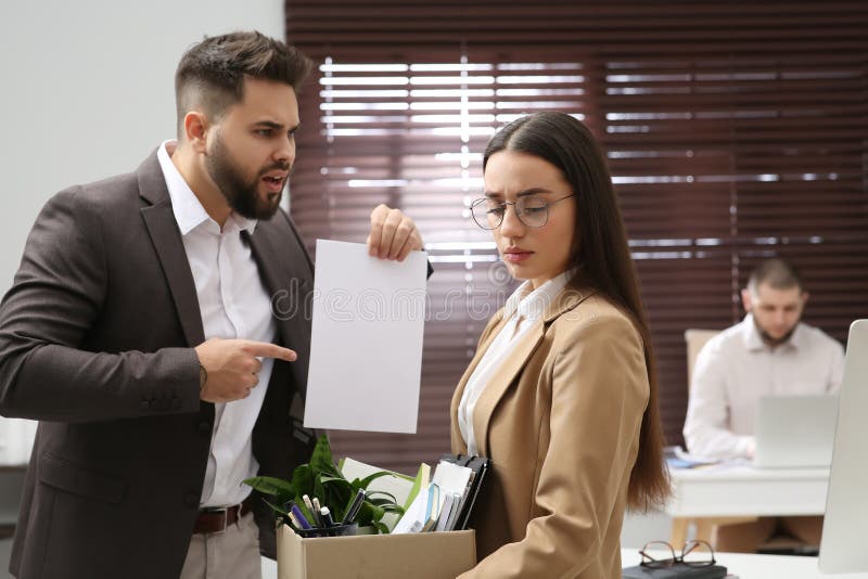 Boss Dismissing Young Woman from Work in Office Stock Image - Image of ...