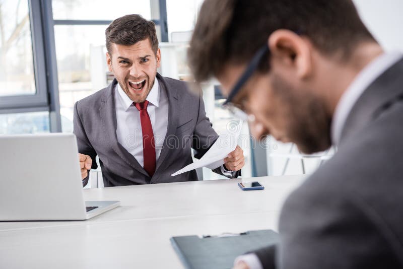 Boss with Documents Shouting at Upset Colleague at Workplace Stock ...