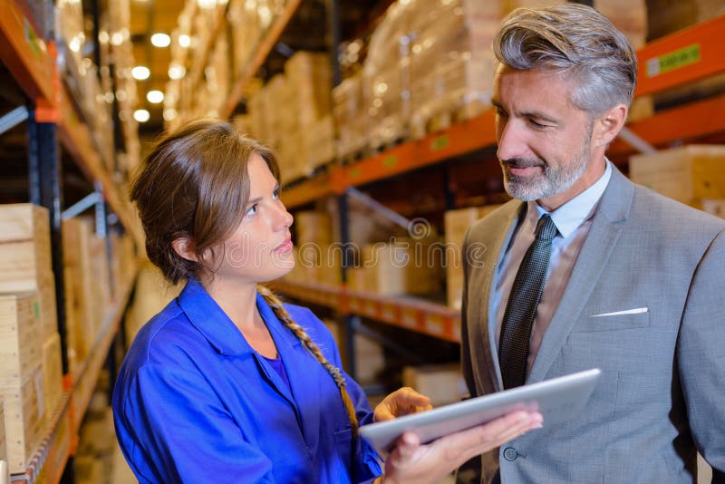Boss and Employee in Warehouse Stock Image - Image of mature, tablet ...