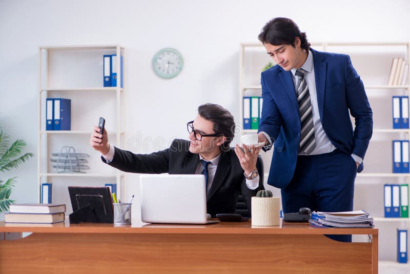 Boss and His Male Assistant Working in the Office Stock Image - Image ...