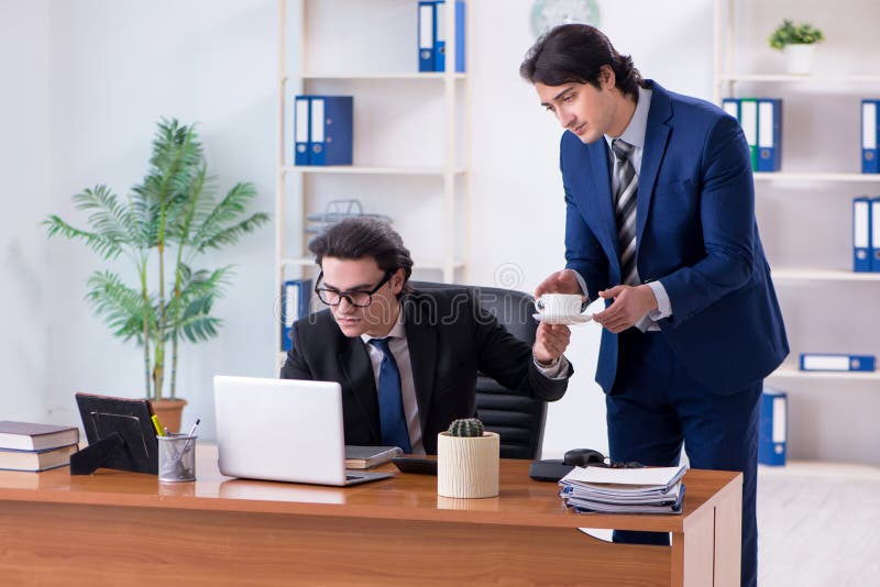 Boss and His Male Assistant Working in the Office Stock Image - Image ...