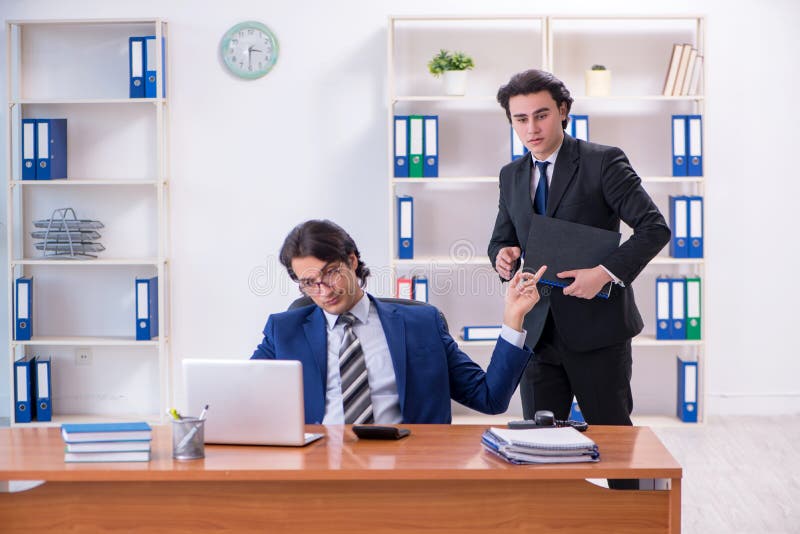 Boss and His Male Assistant Working in the Office Stock Image - Image ...