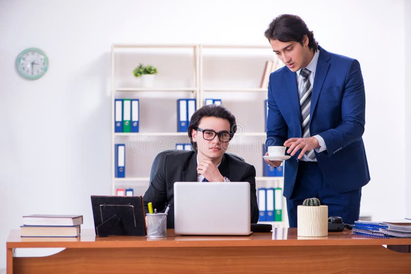 Boss and His Male Assistant Working in the Office Stock Photo - Image ...