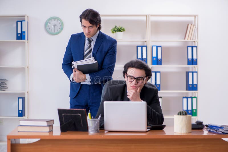 Boss and His Male Assistant Working in the Office Stock Photo - Image ...