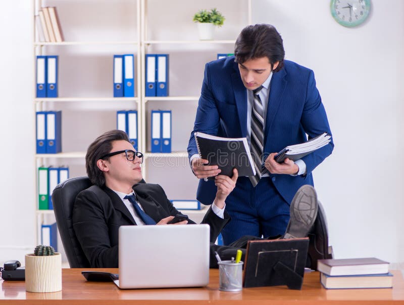 Boss and His Male Assistant Working in the Office Stock Image - Image ...