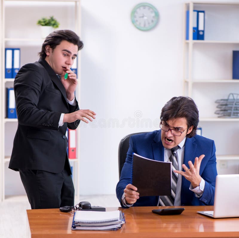Boss and His Male Assistant Working in the Office Stock Photo - Image ...