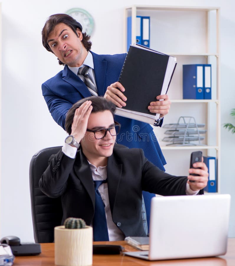 Boss and His Male Assistant Working in the Office Stock Photo - Image ...