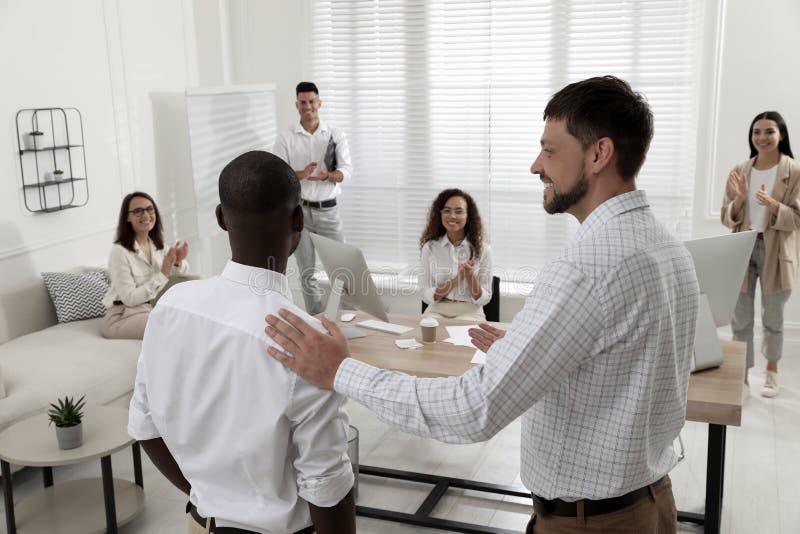 Boss Introducing New Employee To Coworkers in Office Stock Image ...