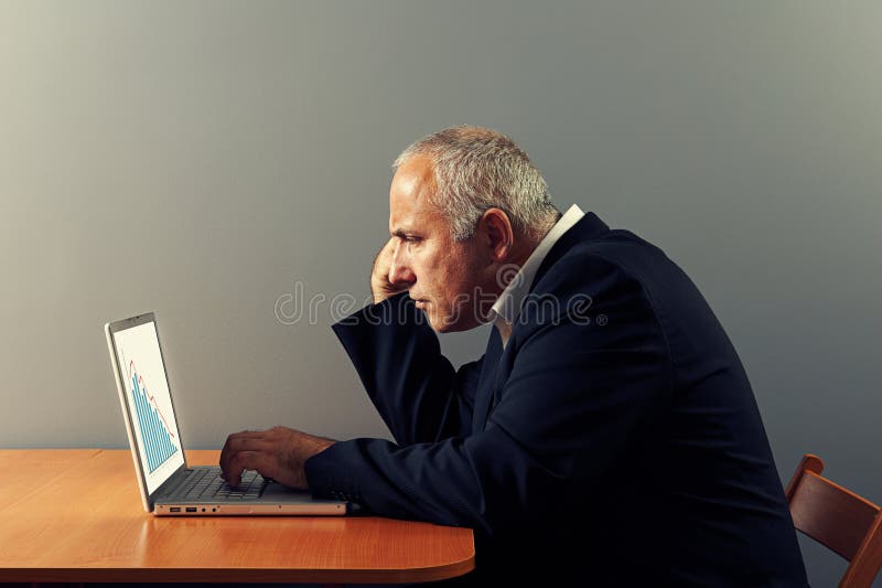 Boss looking at laptop stock photo. Image of diagram - 33470806
