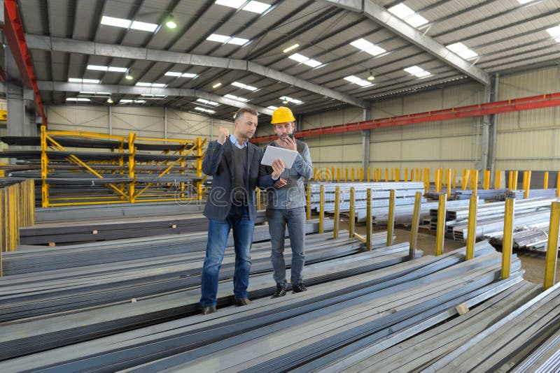 Boss and Manual Worker in Warehouse Stock Photo - Image of cardboard ...