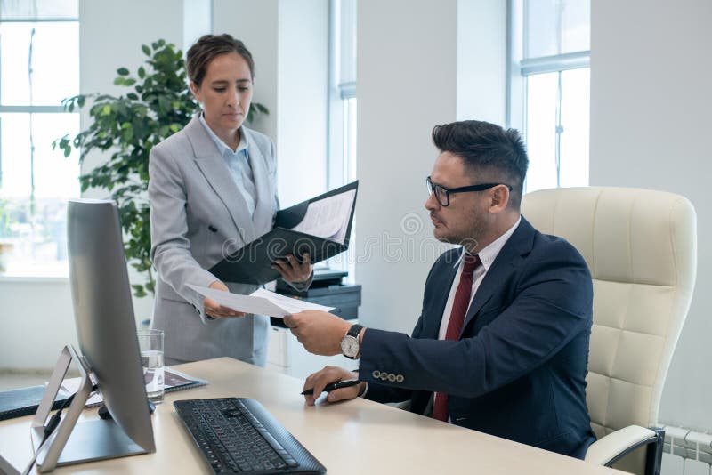 Boss Passing Signed Document To His Secretary Stock Photo - Image of ...