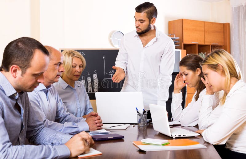 Boss and Stressed Co-workers Stock Photo - Image of chart, indoors ...