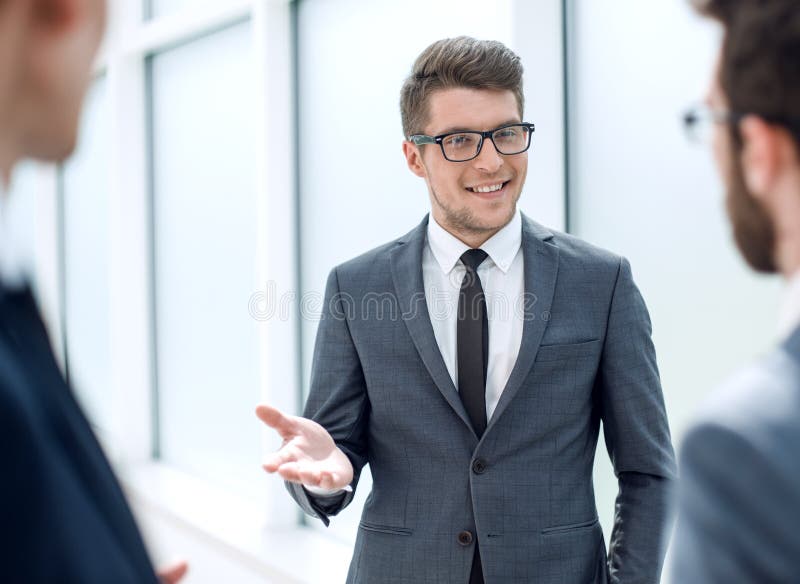 Boss Talking To Employees Standing in the Office Stock Photo - Image of ...