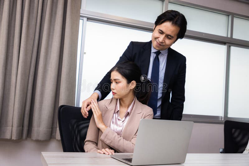 A Boss Touching the Shoulder of Employee Colleague in Workplace at ...