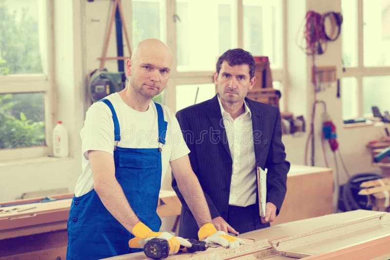 Boss and Worker in a Carpenter`s Workshop Stock Image - Image of ...