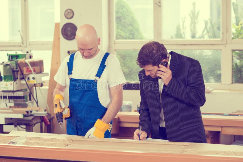 Boss and Worker in a Carpenter`s Workshop Stock Photo - Image of ...
