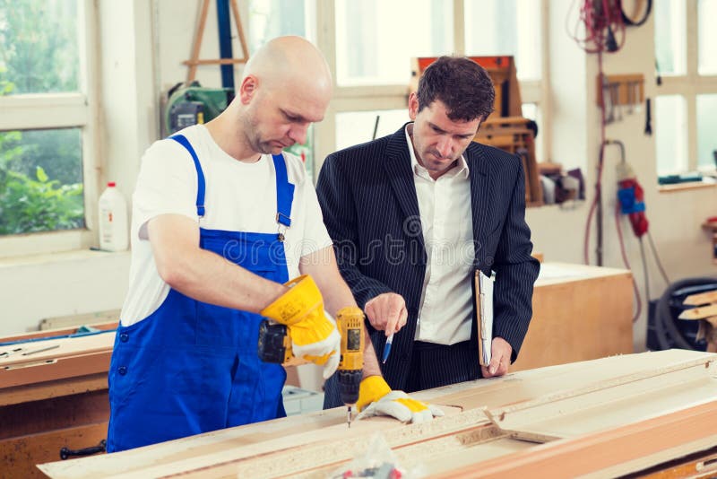 Boss and Worker in a Carpenter`s Workshop Stock Photo - Image of ...