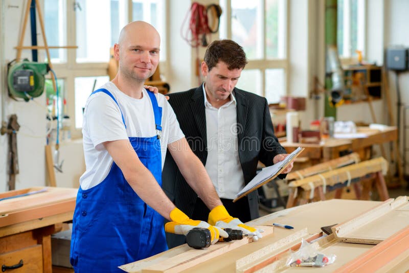 Boss and Worker in a Carpenter S Workshop Stock Photo - Image of ...