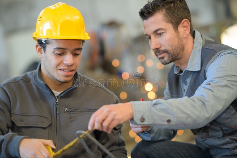 Boss and Worker in Yellow Hard Hat at Warehouse Stock Photo - Image of ...