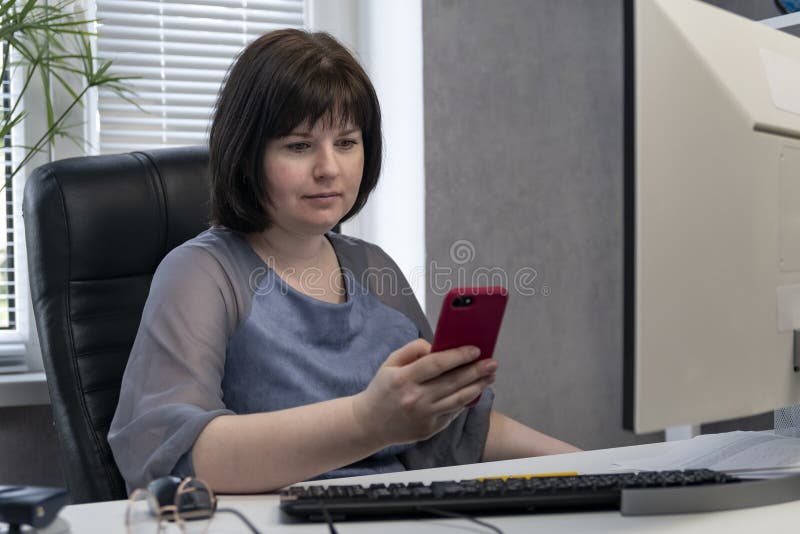 Boss at Workplace with Phone in Hands. Business Woman Decides Business ...