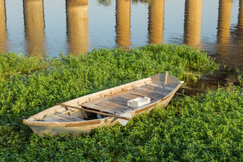 A bot in a river stock image. Image of pillers, green - 127946943