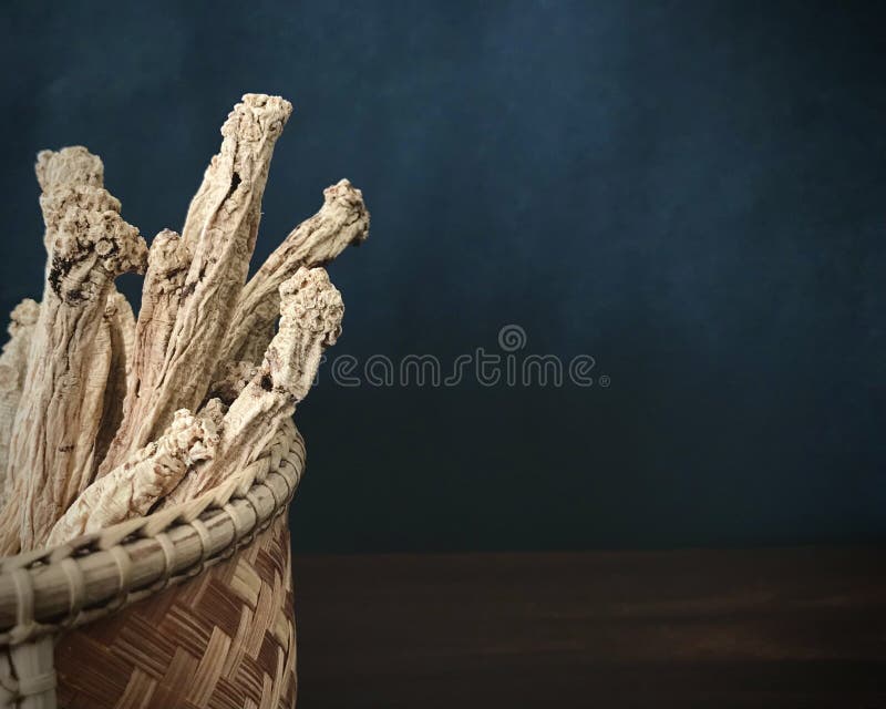 Codonopsis Root in Basket on Brown Wooden Table with Black Background ...