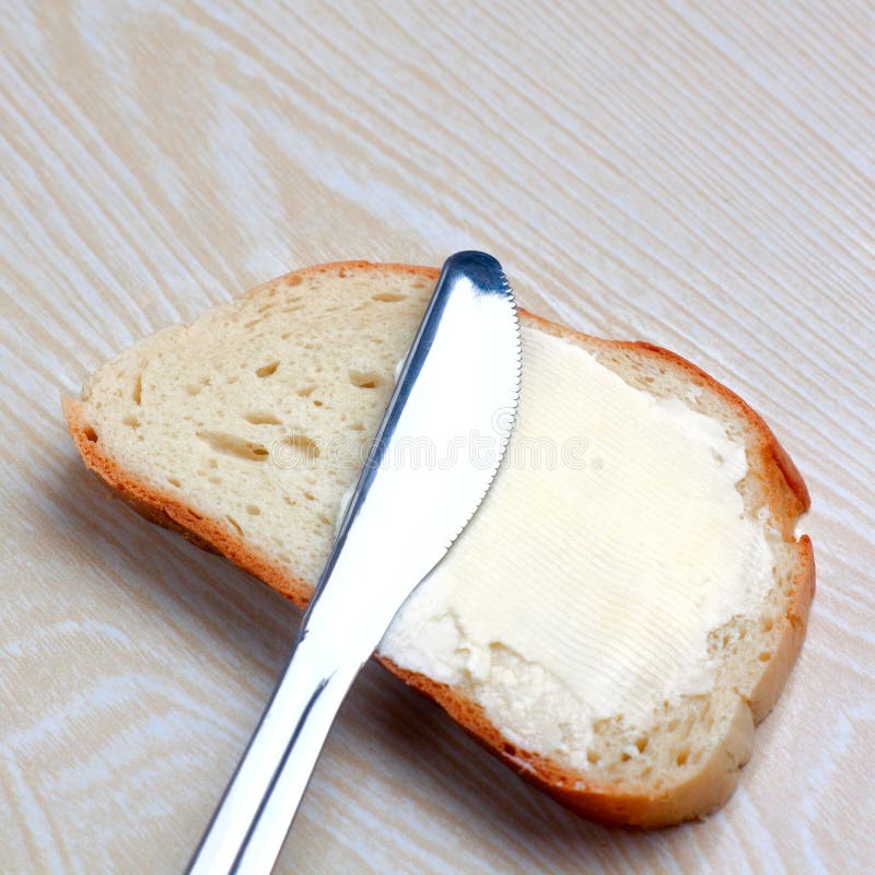 Boter op een sneetje brood stock afbeelding. Image of product - 25391851