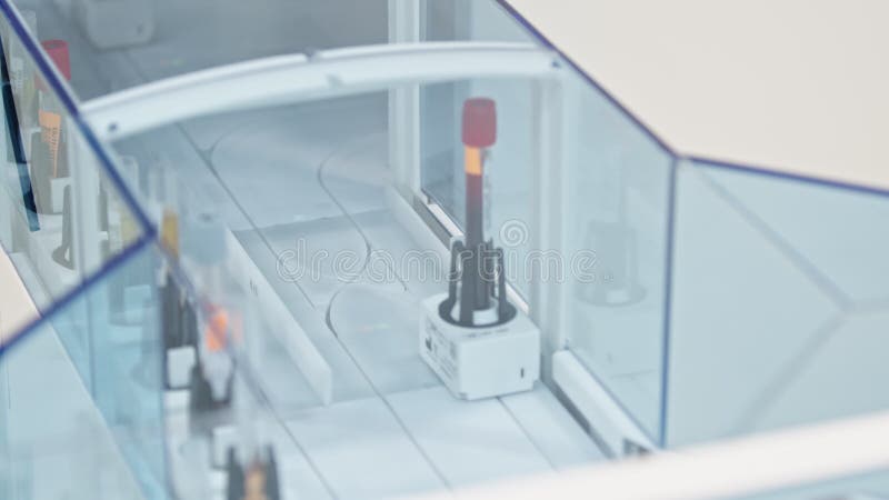 Both Full and Empty Test Tubes Moving One after Another in an Automated ...