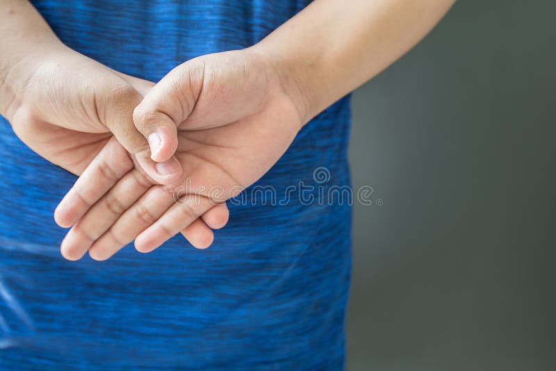 Both hands crossed in back stock image. Image of badge - 303124693