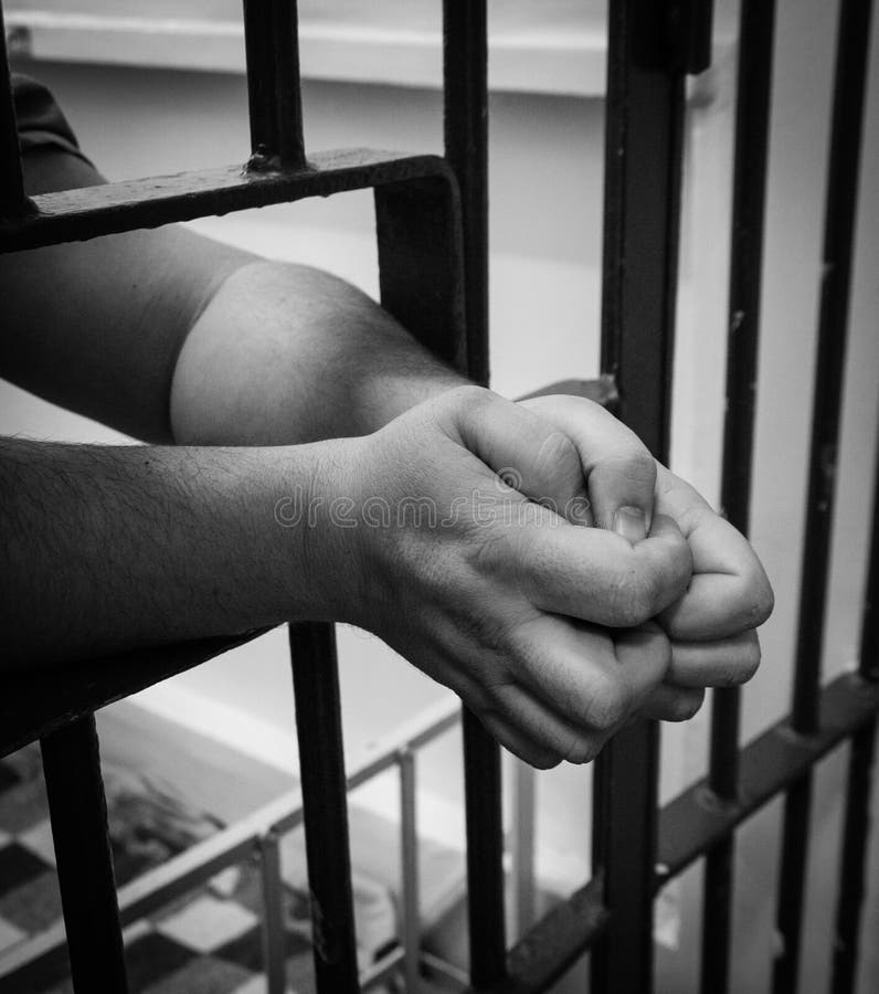 Discouraged Prisoner Praying Behind Bars Stock Image - Image of wire ...