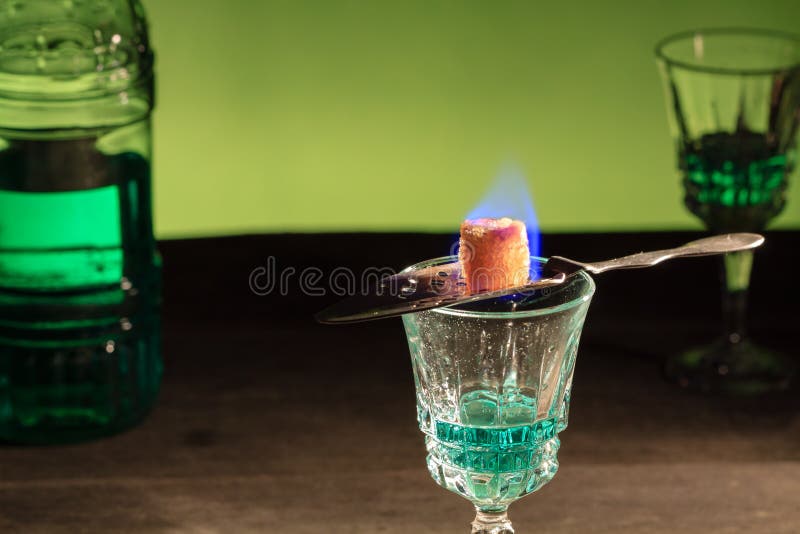 Absinthe stock image. Image of bottle, cubes, fire, dark - 115568947