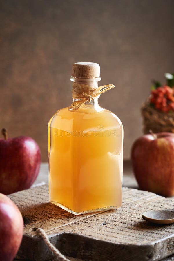 A Bottle of Apple Cider Vinegar with Fresh Red Apples Stock Photo ...