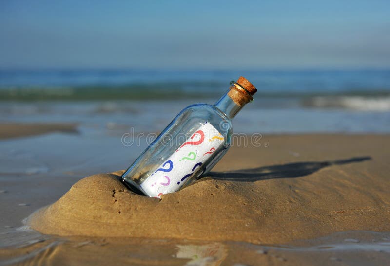 Bottle on the Beach with Colored Question Marks Inside. Many Unknowns ...