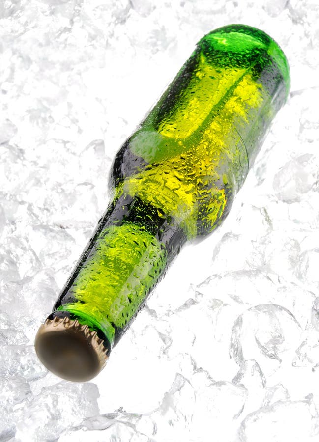 Bottle of beer on ice stock photo. Image of frosty, foam - 14596418