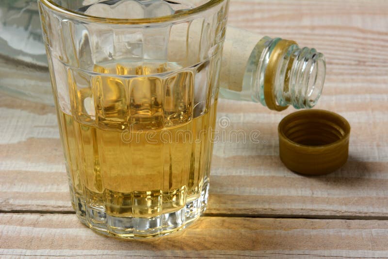 Bottle of Booze and a Glass Stock Photo - Image of wood, glass: 51090344