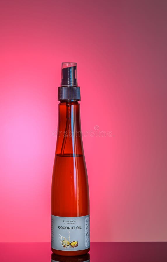 Bottle of Coconut Oil on a Red Background. Close-up Editorial ...