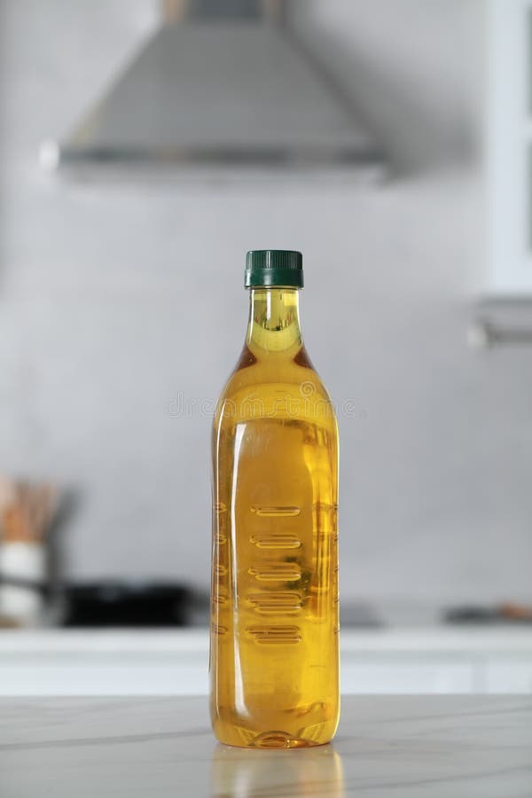Bottle of Cooking Oil on White Marble Table in Kitchen Stock Photo ...