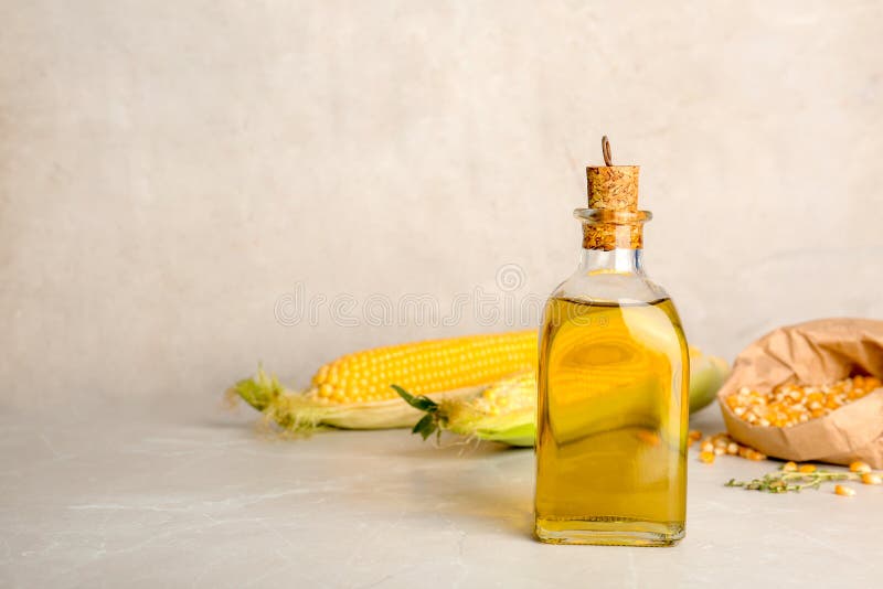Bottle of Corn Oil and Fresh Cobs on Table Stock Image - Image of ...