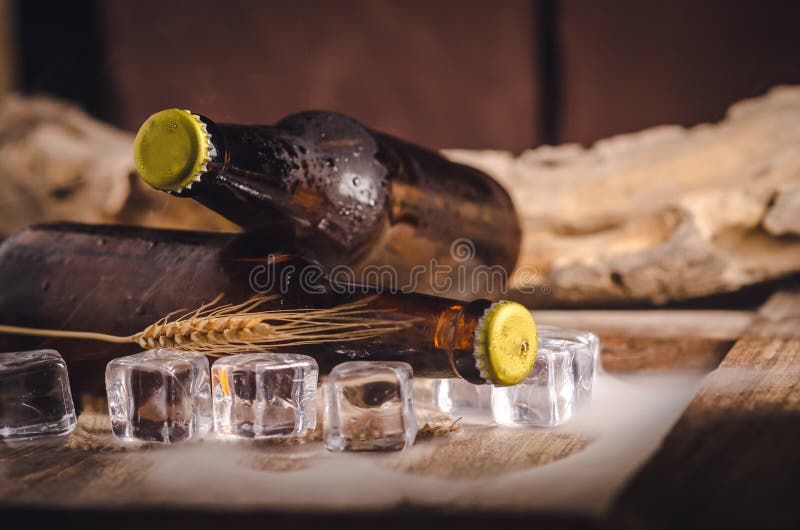 Bottle Draft Beer and Ice on Wooden Table Stock Image - Image of ...
