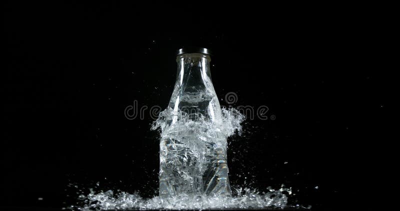 Bottle Falling and Exploding on Black Background Stock Image - Image of ...