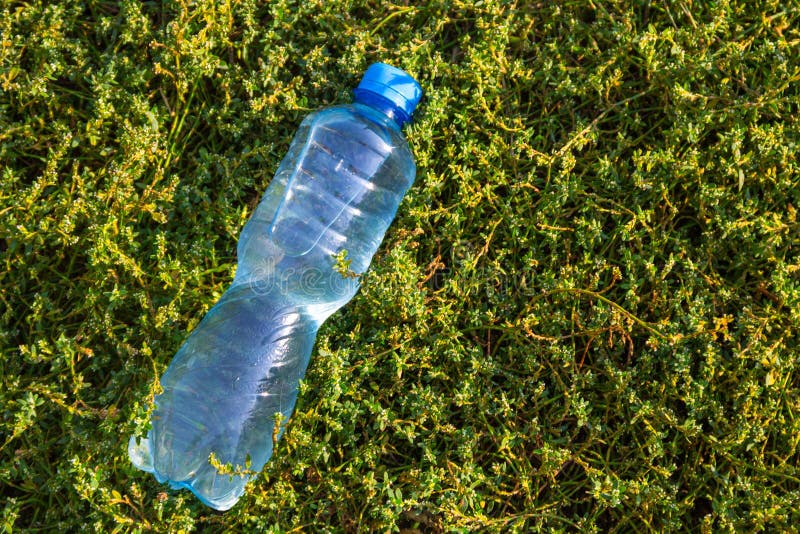 Bottle with Fresh Clean Water on Green Grass Stock Photo - Image of ...