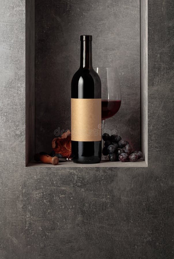 Bottle and Glass of Red Wine with Blue Grapes Stock Photo - Image of ...