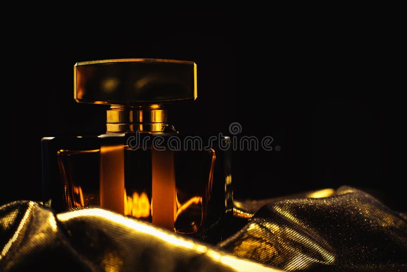 Bottle of golden perfume stock photo. Image of aromatic - 102925904